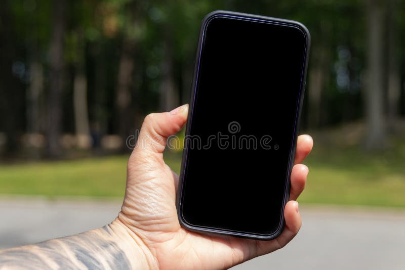 Tattooed Wrist Holding Mobile Phone Outdoors Stock Photo - Image of ...