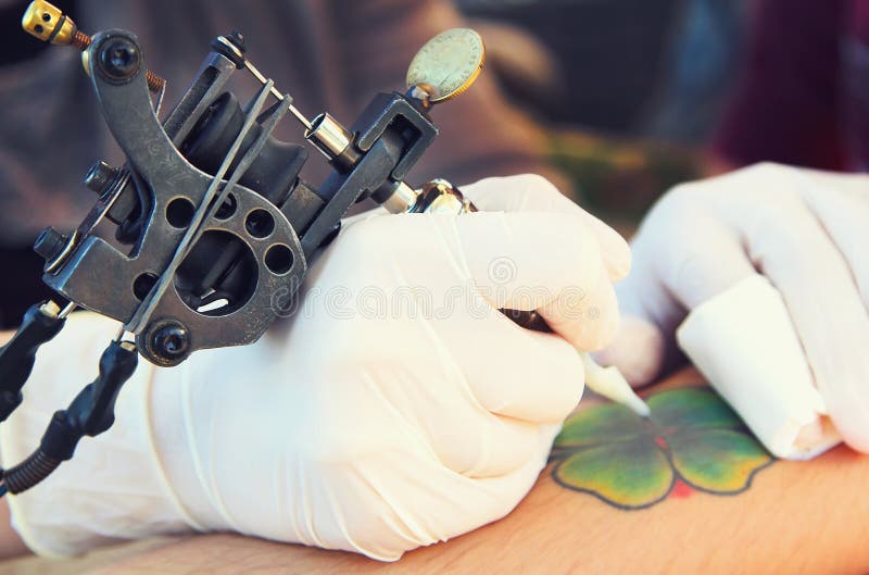 Tattooer Showing Process of Making a Tattoo Stock Photo - Image of ...