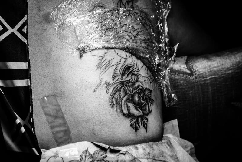 Tattooer Showing Process of Making a Tattoo Editorial Stock Image ...