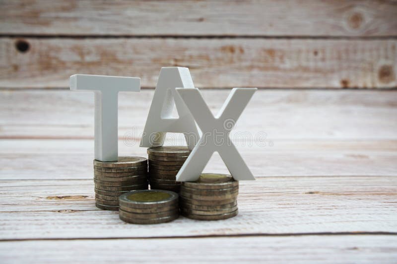 TAX Alphabet Letters with Coin Stack on Wooden Background Stock ...