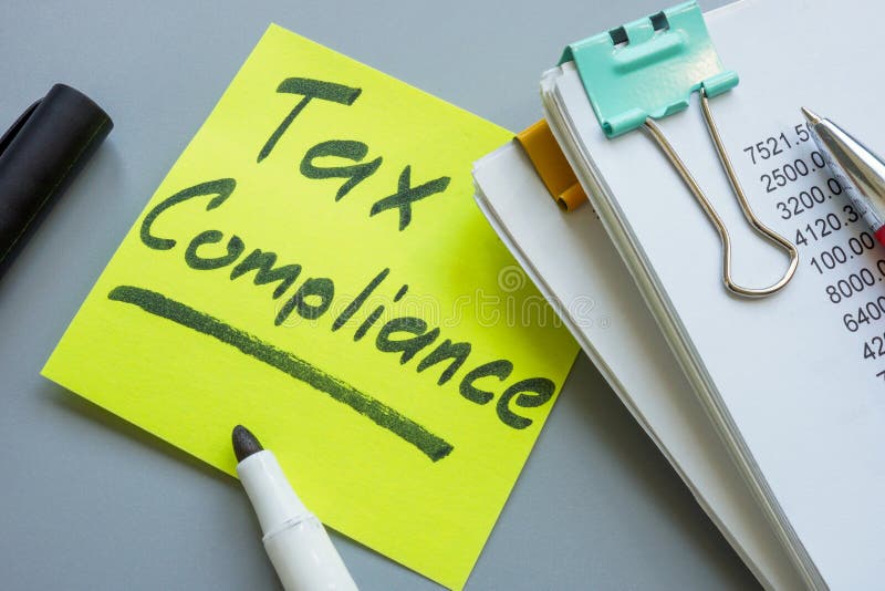 Tax Compliance. Stack of Accounting Documents and Sticky Note. Stock ...