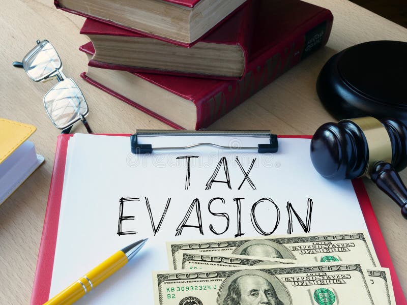 Tax Evasion is Shown Using the Text and Photo of Dollars and Gavel ...