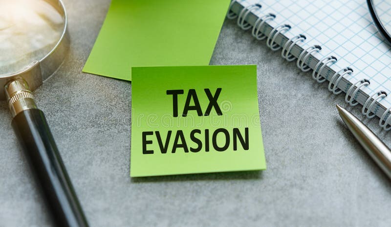 Tax Evasion Text on the Diary Paper for Writing on Gray Background ...