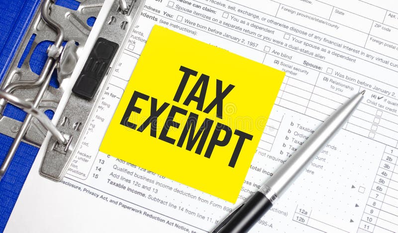 Tax Exempt Words with Tax Forms on Blue File Folder Stock Image - Image ...