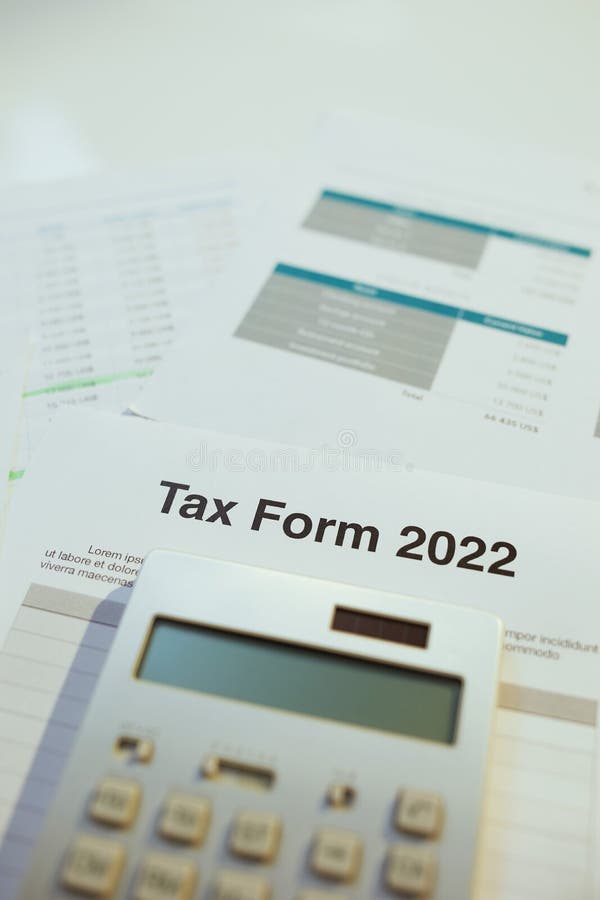 Tax Form 2022 and Calculator at Desk Stock Photo - Image of home, house ...