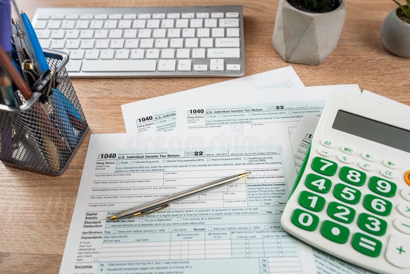 1040 Tax Form Documents with Pen and Computer Keyboard on Office Desk ...