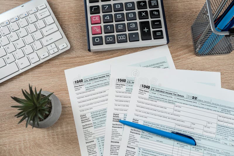 1040 Tax Form Documents with Pen and Computer Keyboard on Office Desk ...
