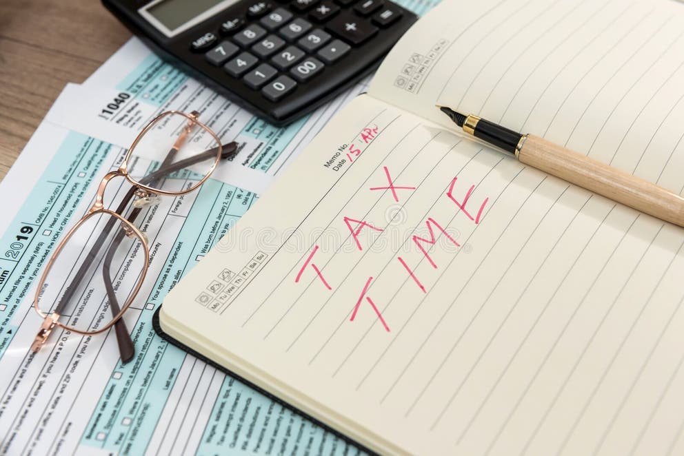 Tax Form 1040 with Notepad and Text Tax Time, Pen and Calculator. Tax ...