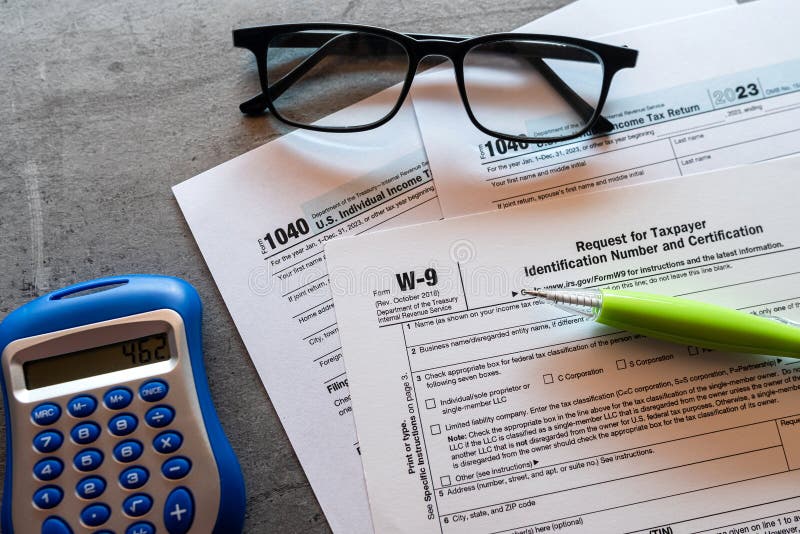 1040 Tax Form, Pen Calculator Glasses on Table Editorial Photography ...