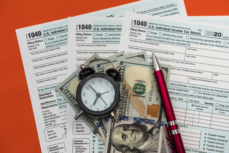 Tax Forms 1040 with Clock Pen and Dollar Bills Editorial Stock Photo ...