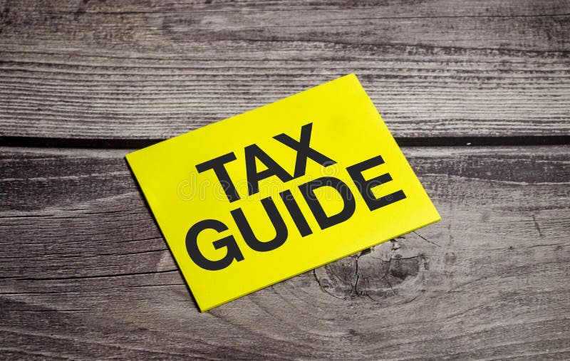 TAX GUIDE Text on Business Paper on Office Table Stock Photo - Image of ...