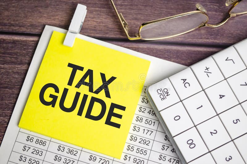 TAX GUIDE Text on Business Paper on Office Table Stock Image - Image of ...