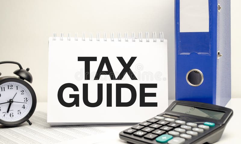TAX GUIDE Words on White Sticker with Calculator and Clock Stock Image ...