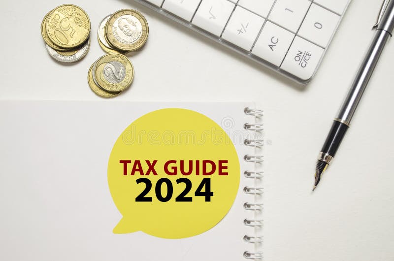 TAX GUIDE 2024 on Yellow Sticker on Pen with Coin Stock Photo - Image ...