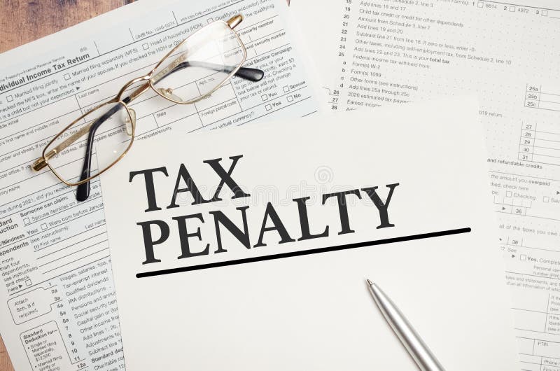 Tax Penalty Words and Tax Forms with Pen and Glasses Stock Photo ...