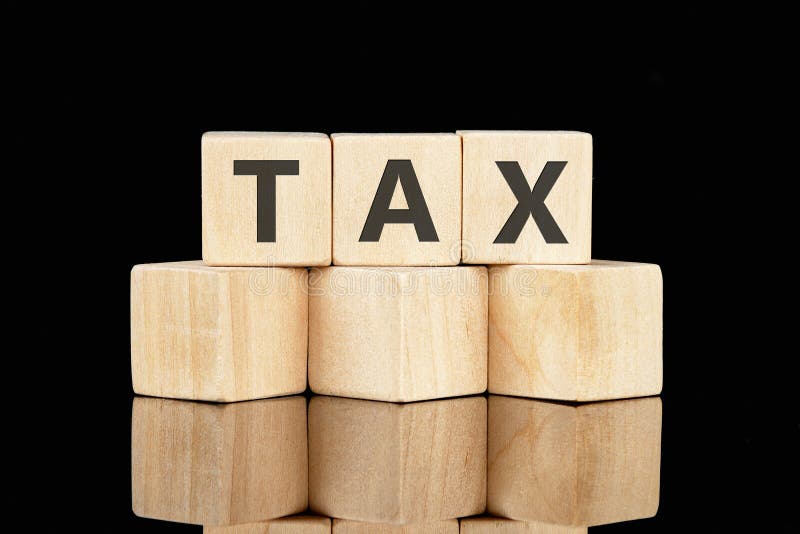 TAX Text Assembled from Wooden Cubes on a Black Background Stock Image ...