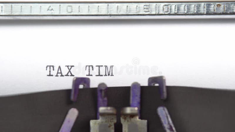 Tax Time Phrase Closeup Being Typing and Centered on a Sheet of Paper ...