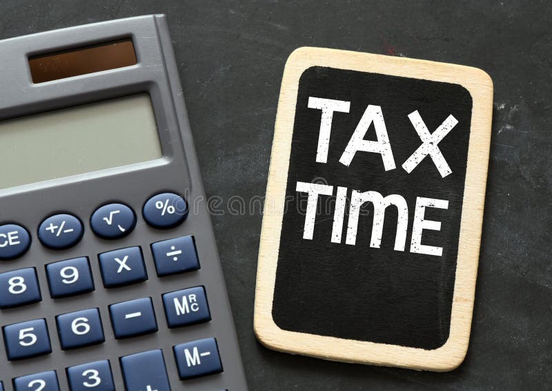 TAX TIME Words Written on a Small Chalkboard Stock Photo - Image of ...