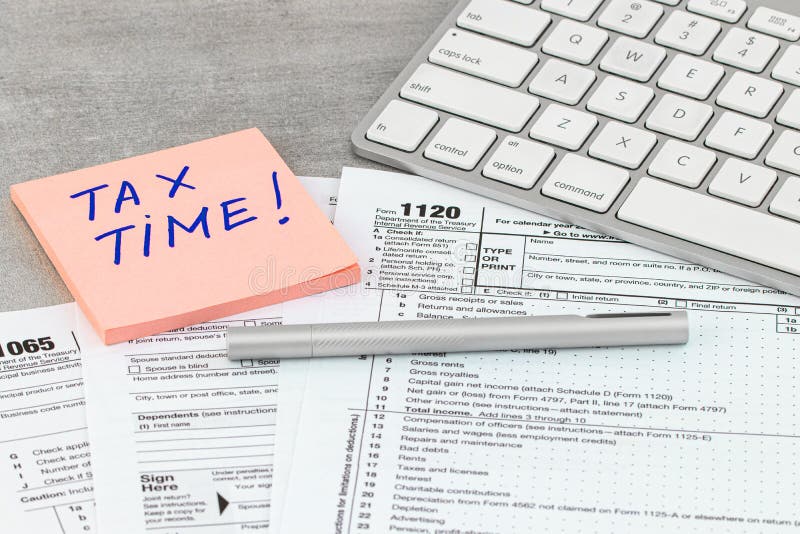 Tax Time Written on Paper Note with Tax Form, and Cup of Coffee ...