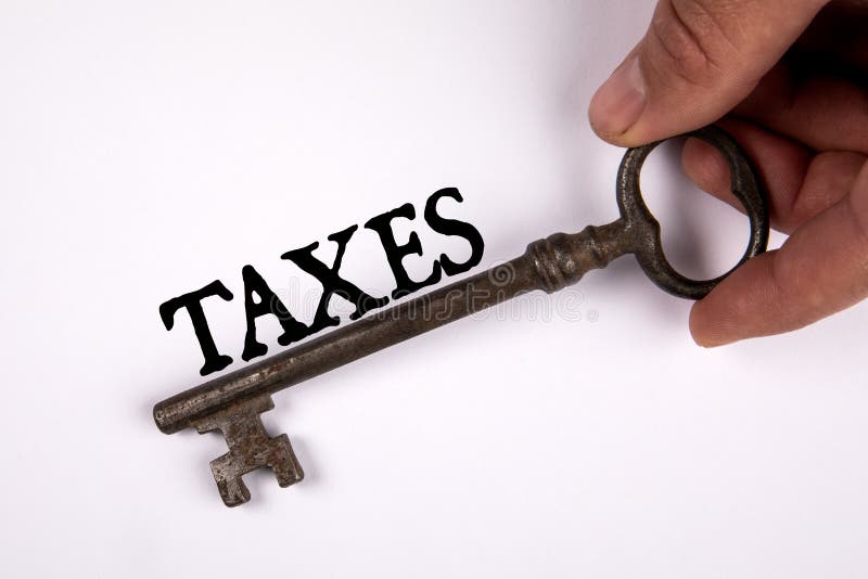 Taxes, Business and Development Concept. Old Door Key on a White ...