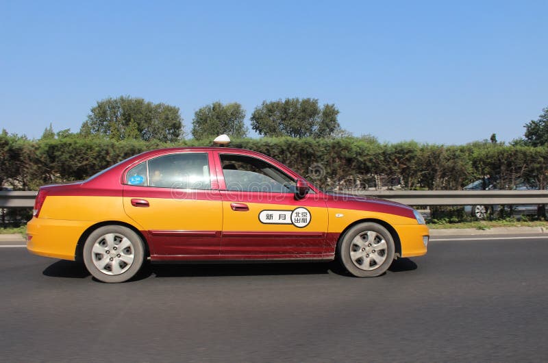 Taxi in Beijing editorial stock image. Image of yellow - 73068304