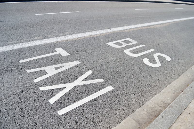 Taxi and bus lane stock photo. Image of sign, stone - 122626360