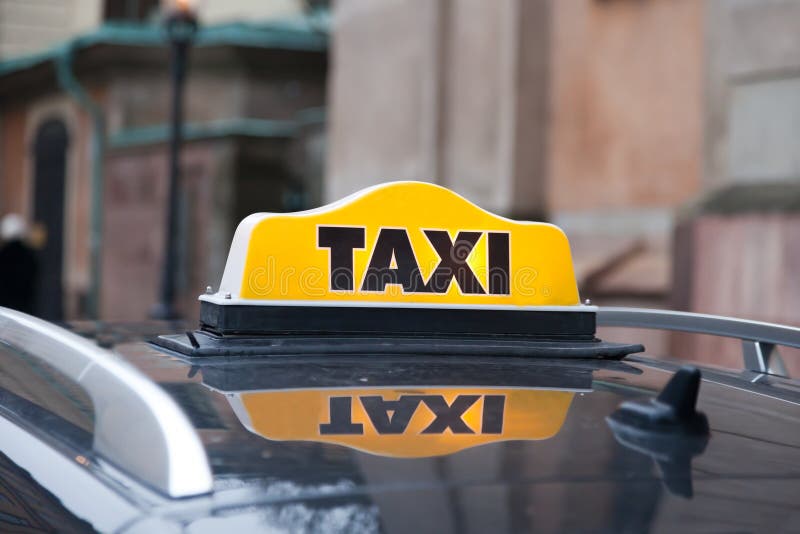 Taxi cap on a car roof stock photo. Image of checkers - 47559450