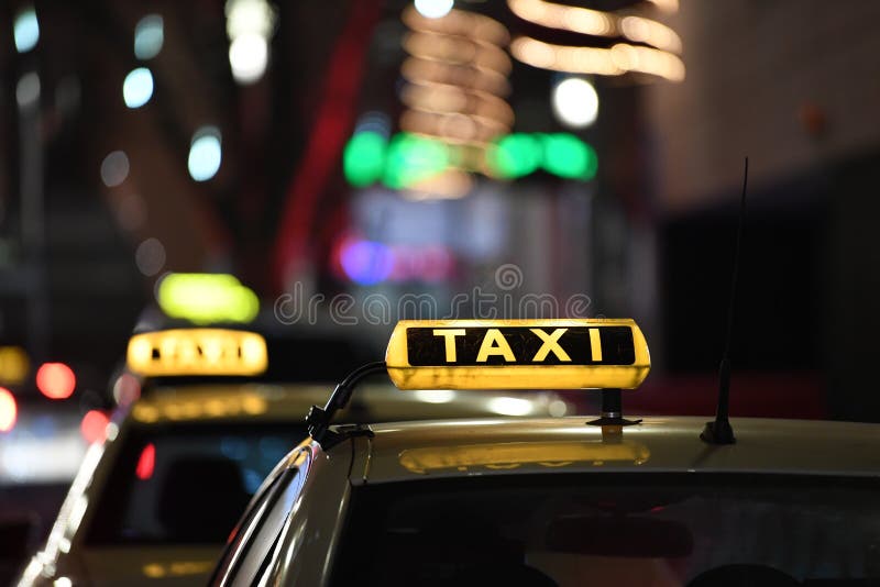 Taxi line up at night stock image. Image of travel, evening - 184119995