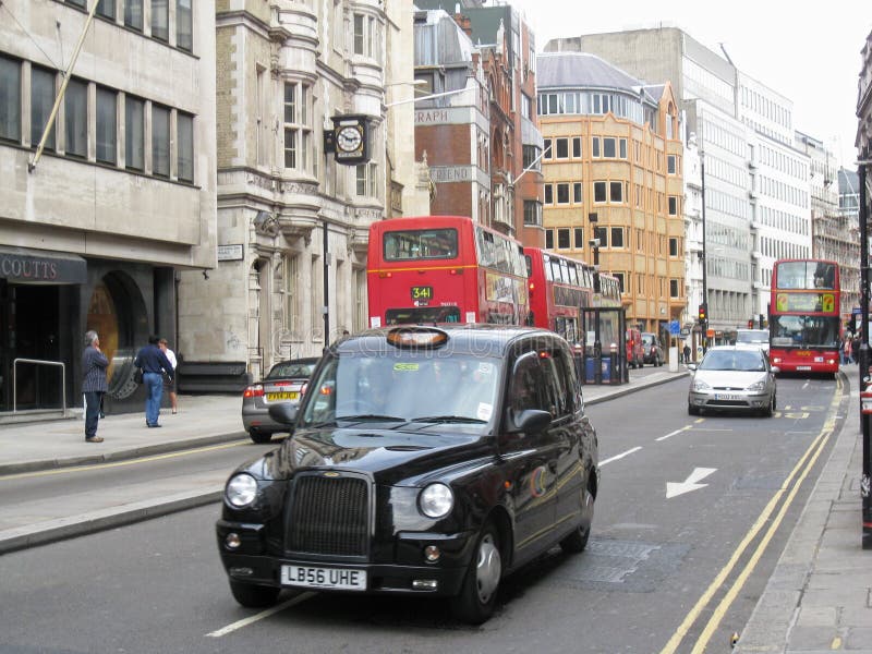 Taxi and Red Bus in London editorial photo. Image of europe - 15504541