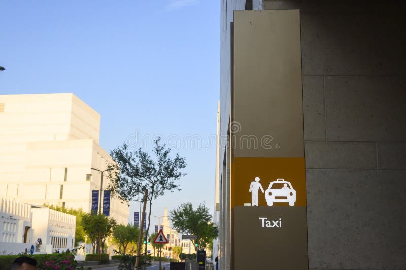 Taxi Sign Hung on the Building Wall Stock Photo - Image of signboard ...