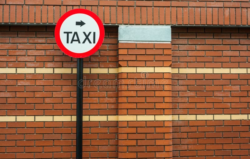 Taxi Sign Red Brick Wall Stock Photos - Free & Royalty-Free Stock ...