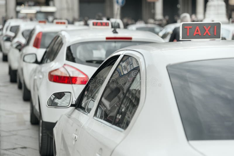 Taxis waiting in line stock photo. Image of sign, street - 40051538