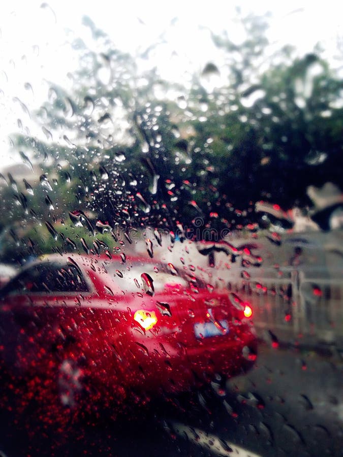 Taxis in the Rain stock image. Image of windows, heavy - 141883435