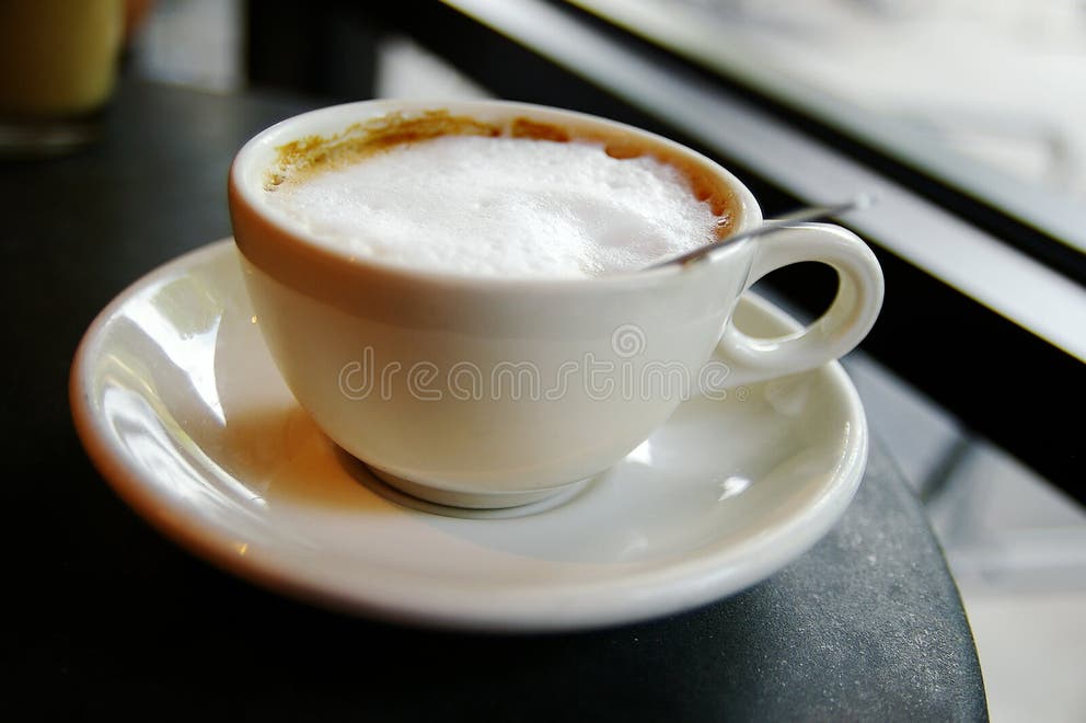 Taza de café foto de archivo. Imagen de java, cremoso - 1065982