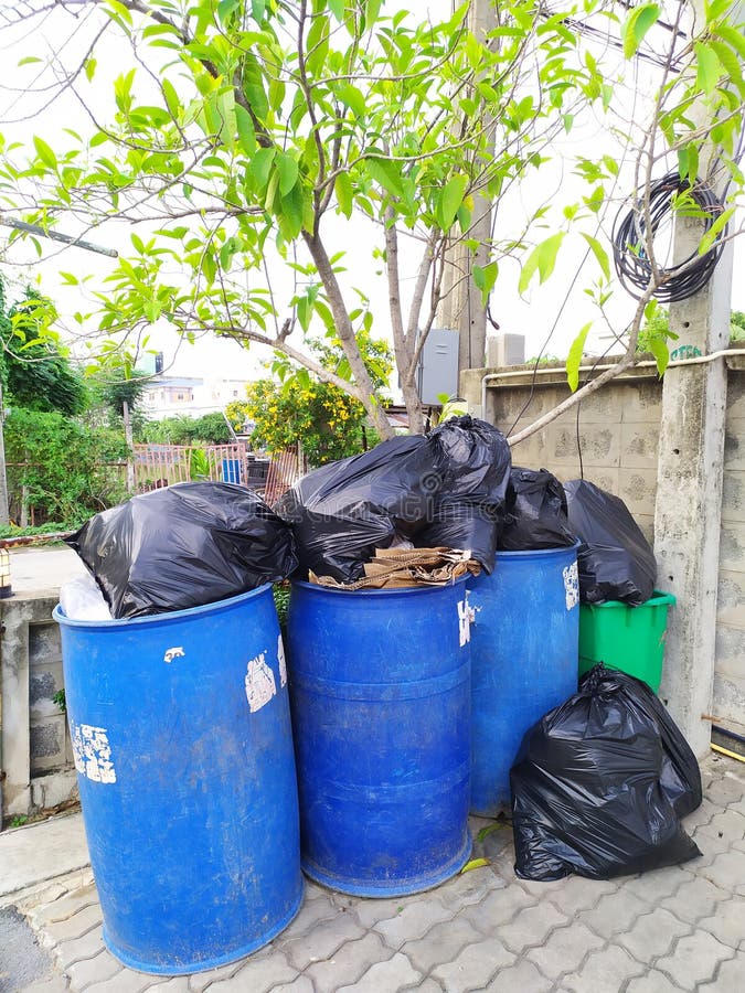 Te Blue Trash is Overflowing with Garbage Stock Image - Image of ...