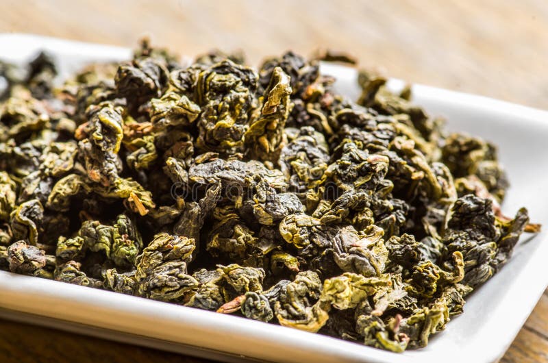 Te Guan Yin Green Tea Leaves on the Rectangular White Plate Stock Image ...