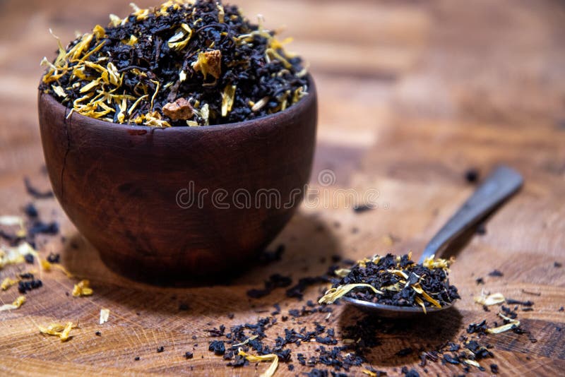 Tea with Additives in a Wooden Bowl, a Metal Teaspoon with Tea on a ...
