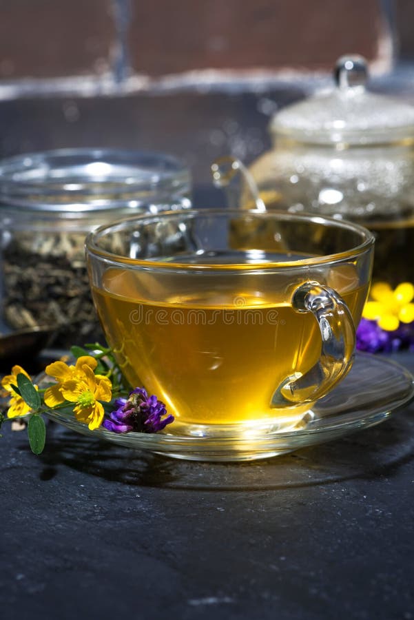 Tea with Aromatic Herbs on a Dark Table, Vertical Closeup Stock Image ...