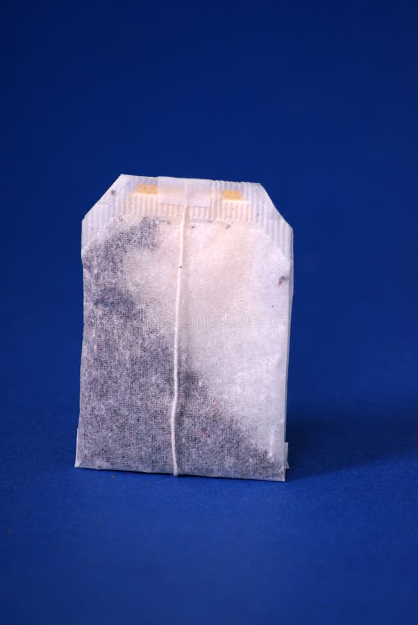 Tea Bag on a Blue Background Stock Photo - Image of food, black: 50657906