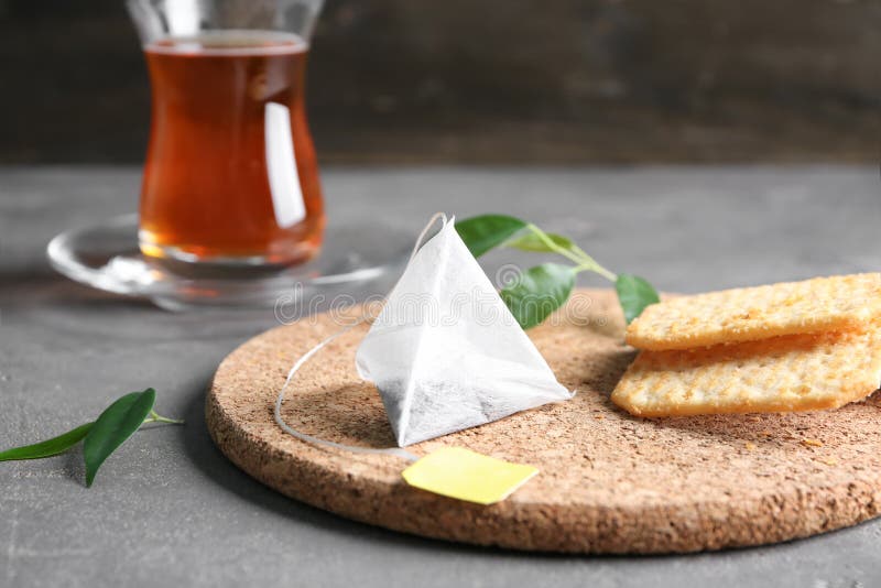 Tea Bag and Crackers on Table Stock Photo - Image of herbal, board ...