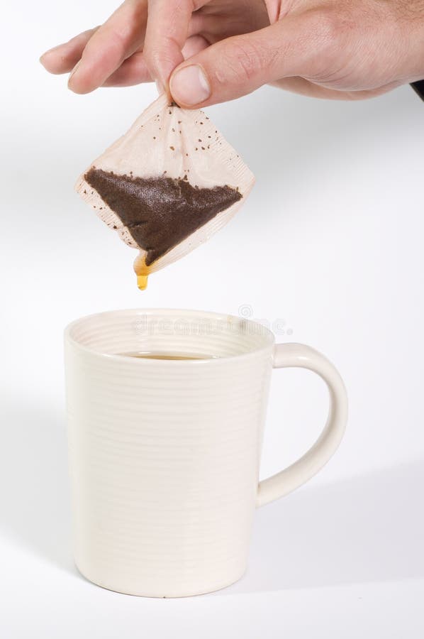 Man Holding Dripping Teabag Stock Image - Image of dripping, beverage ...