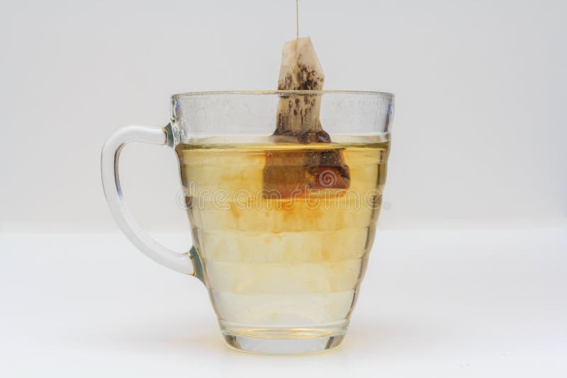 Tea Bag Dipped into Glass Beaker of Hot Water Stock Photo - Image of ...