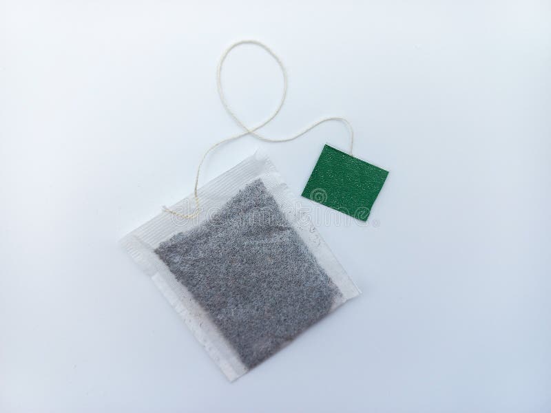 Tea Bag with Green Tag Isolated on White Background. Corner Position ...