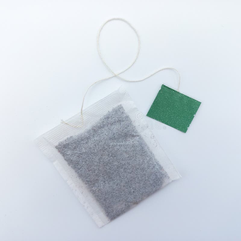 Tea Bag with Green Tag Isolated on White Background. Corner Position ...