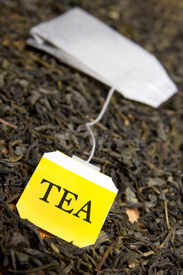 Tea Bag Over Dried Tea Leaves Background Stock Photo - Image of green ...