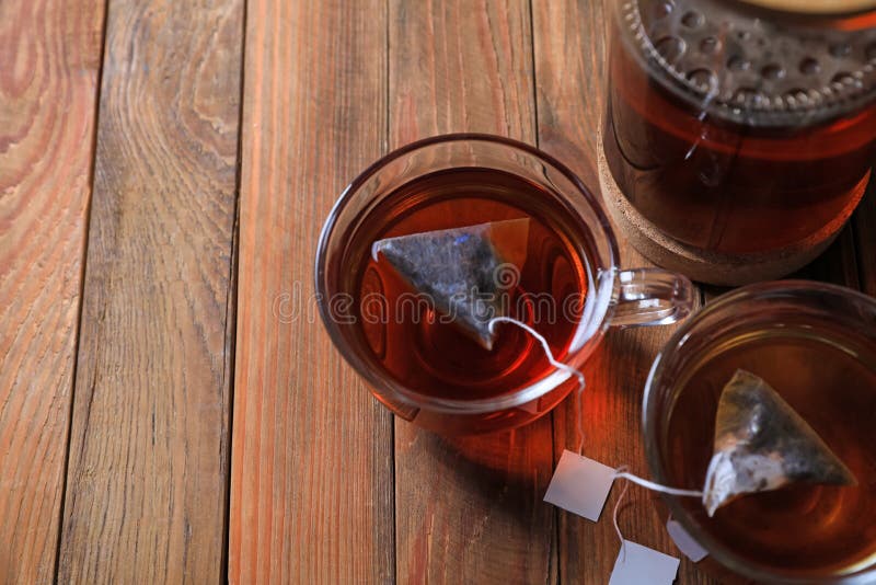 Tea Bags in Cups on Wooden Table, Above View. Space for Text Stock ...