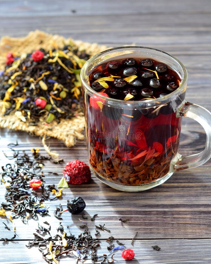 Tea with Berries and Petals on the Table Stock Photo - Image of berry ...