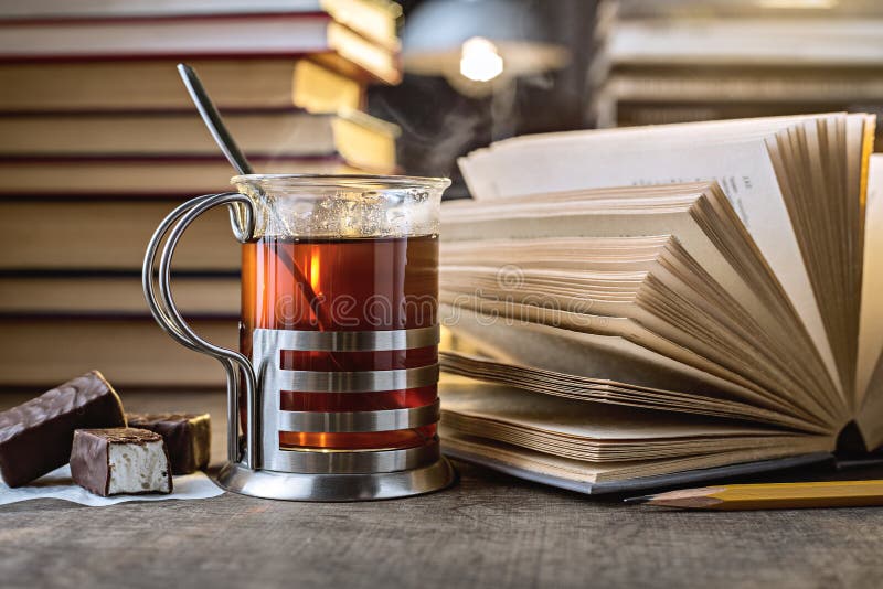 Tea and books. stock photo. Image of steam, glasses, drinks - 90332382