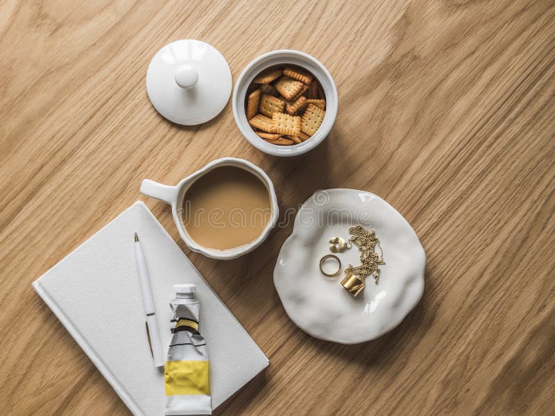 Tea Break - a Cup of Tea with Milk, Crackers, Notepad, Hand Cream ...