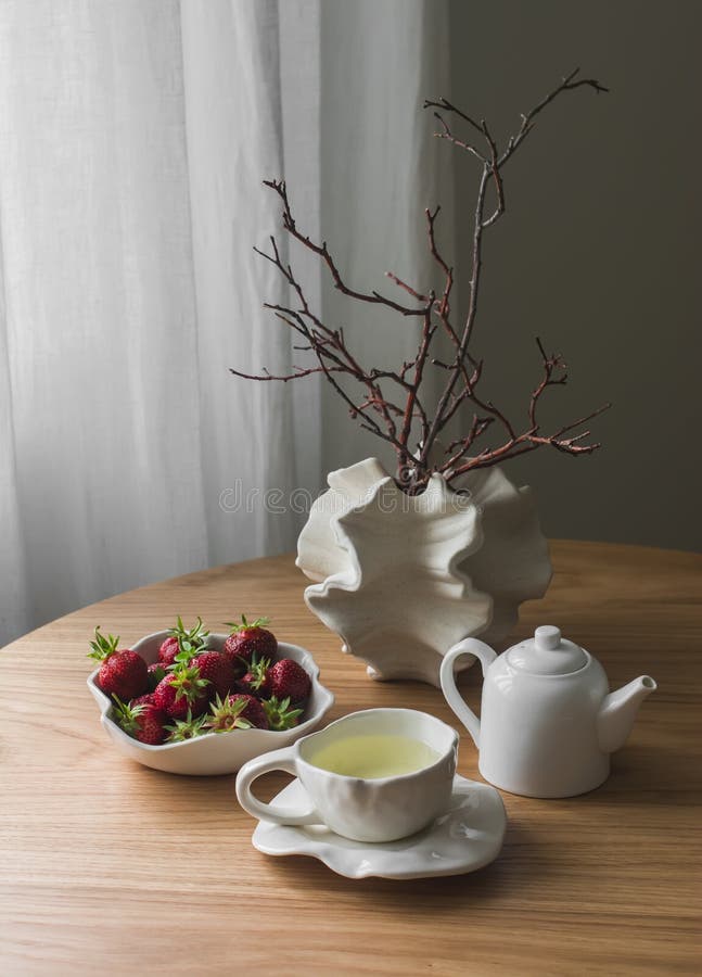Tea Break - Green Tea in a Ceramic Cup, Strawberries, Creative Vase on ...